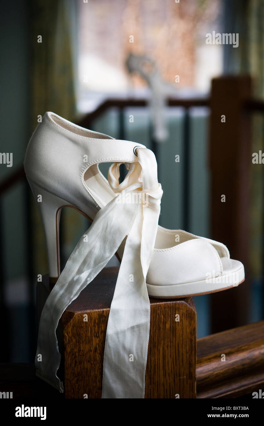 White High Heeled Shoes on a Bannister Rail Stock Photo - Alamy