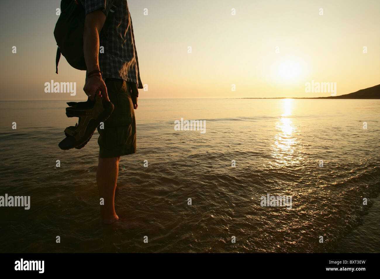 Young man wading in sea hi-res stock photography and images - Alamy
