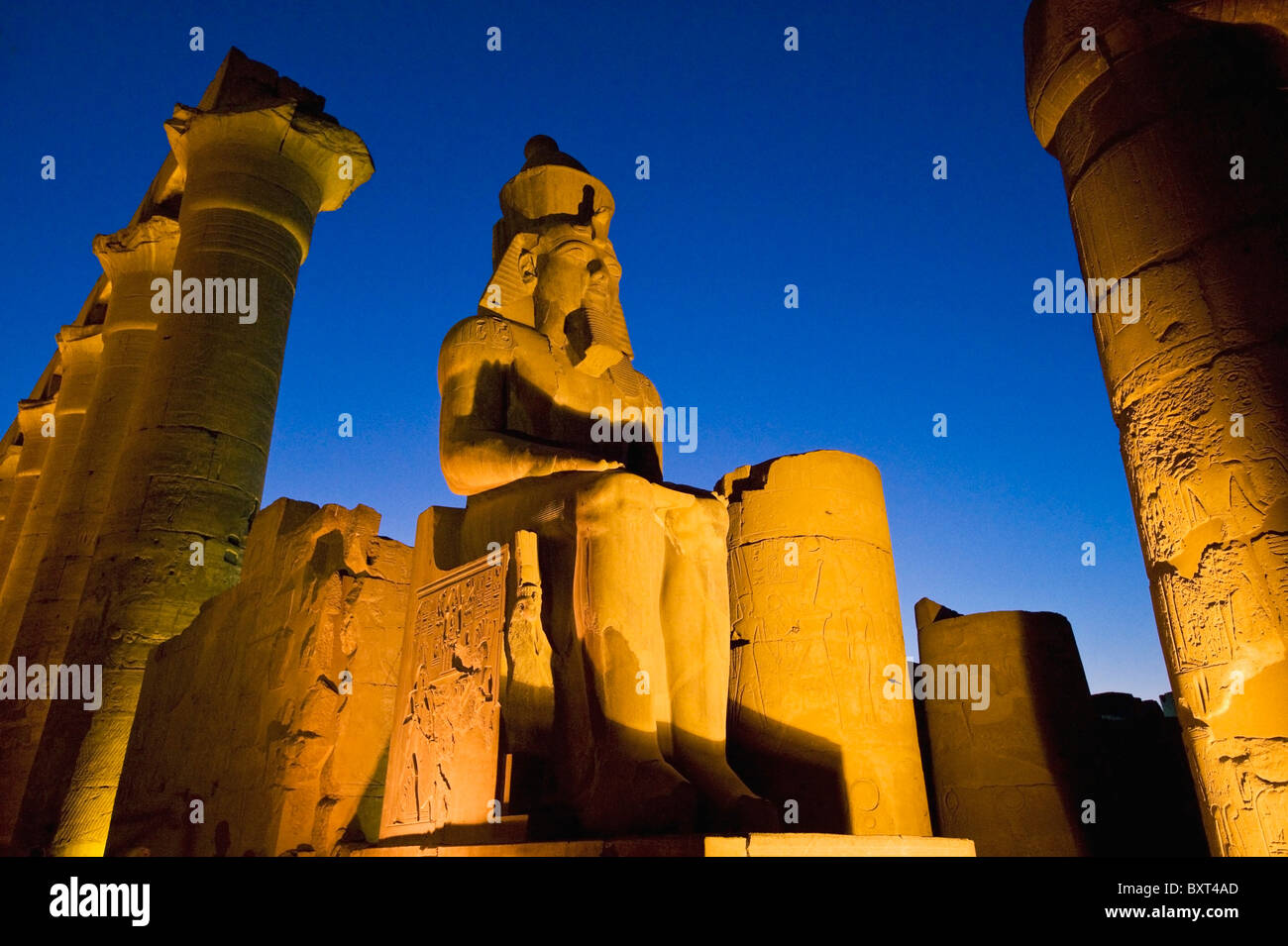 Colonnade Of Amenophis Iii With Statue Of Ramses Ii At Dusk Stock Photo ...