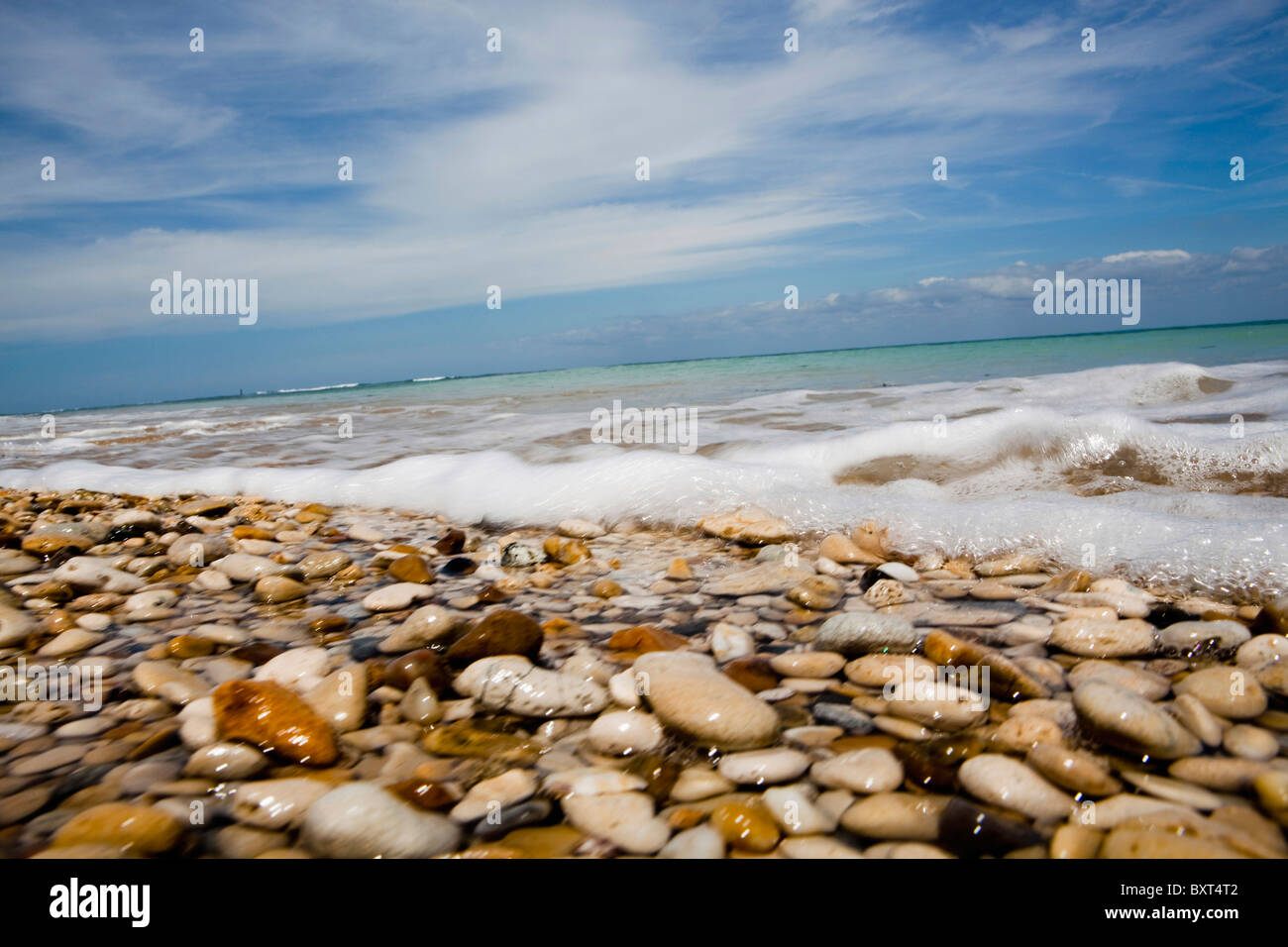 Sea Washing In Onto Sandy Beach Stock Photo - Alamy
