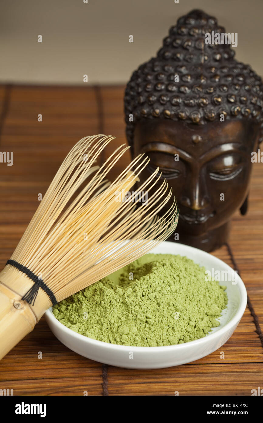 Traditional Zen image of a bronze buddha and japanese green tea Stock ...