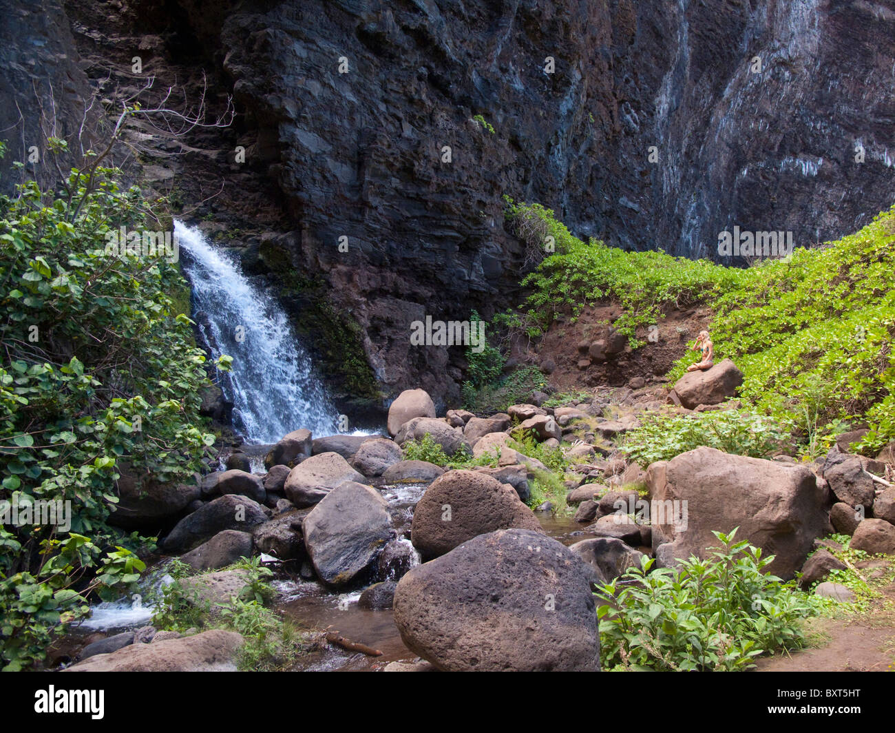 Waterfall in Honopu Valley near the Na Pali coastline, Kauai Stock ...