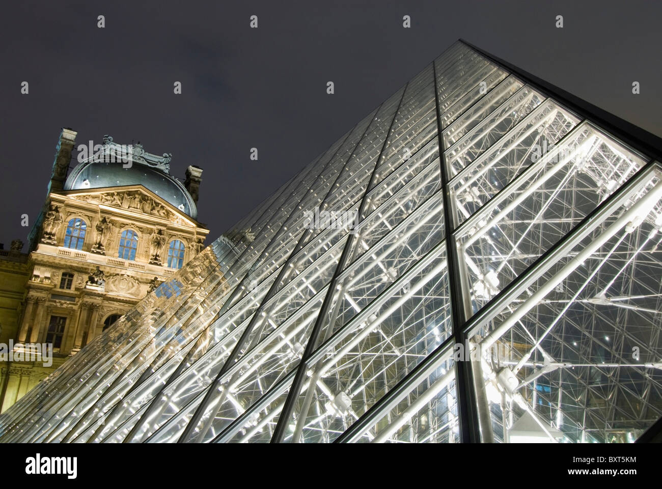 The Glass Pyramid And The Louvre At Dusk Stock Photo - Alamy