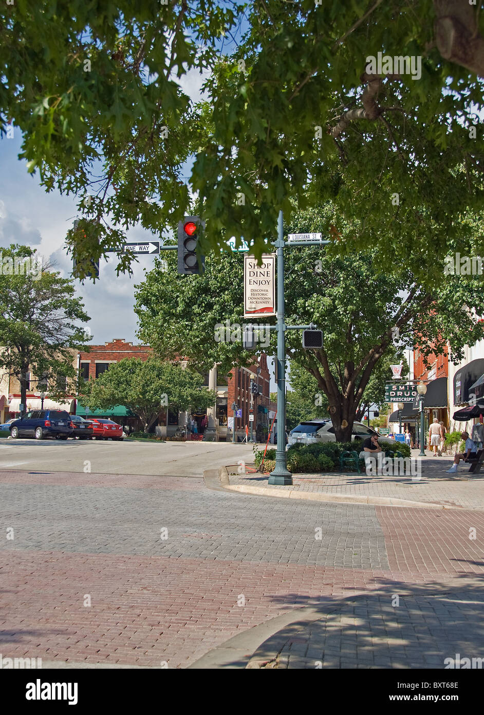 Store front buildings with vehicles parked in front in the historic ...