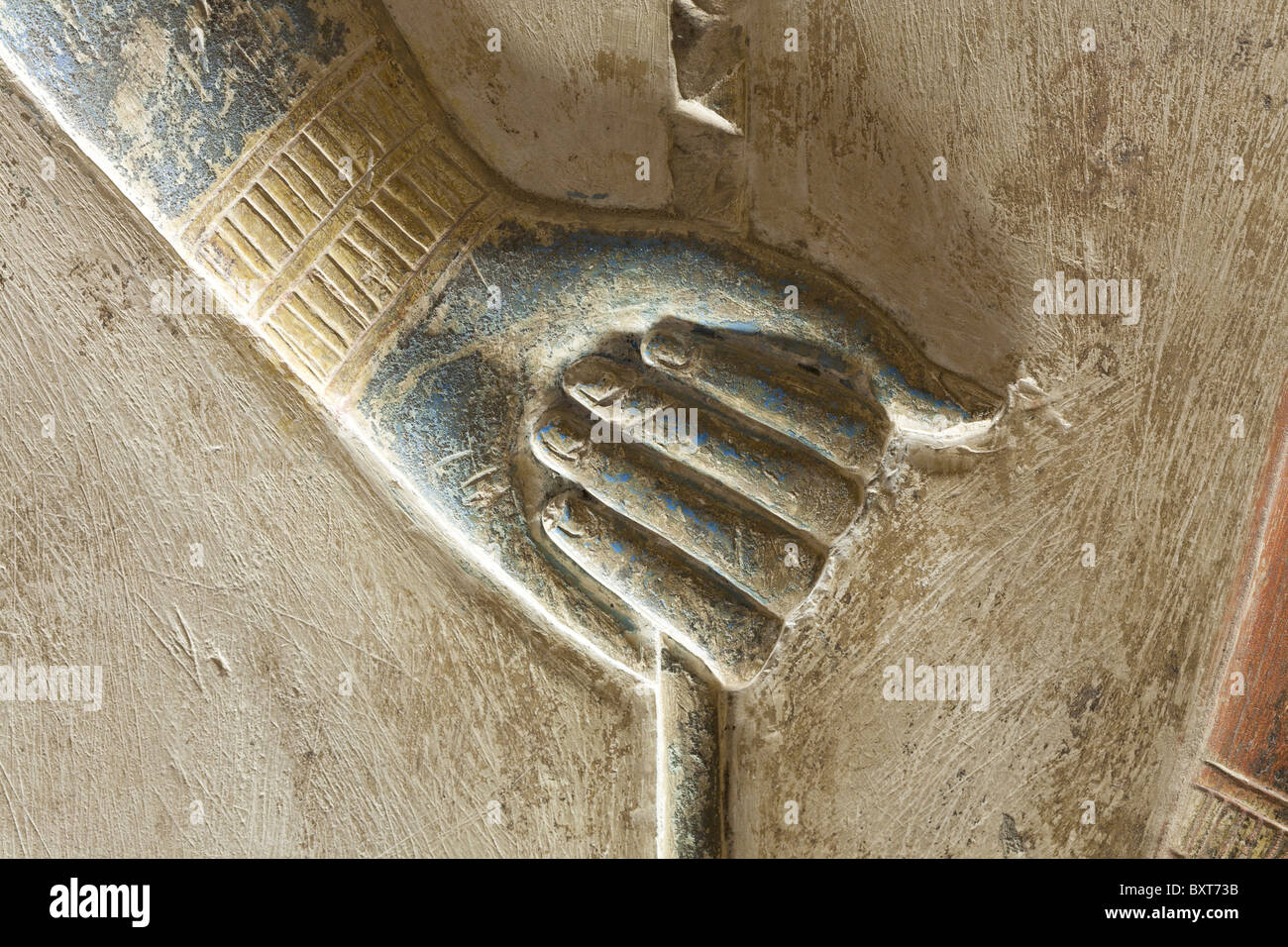 Close up of relief of hand holding staff within the Temple of Seti I at ...