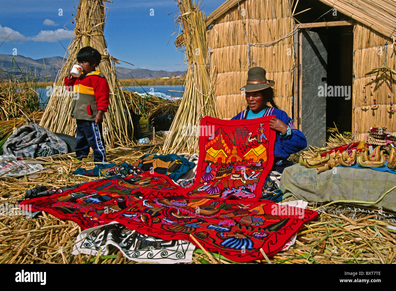 Uros Indian woman selling weavings on tortora reed island, Lake ...