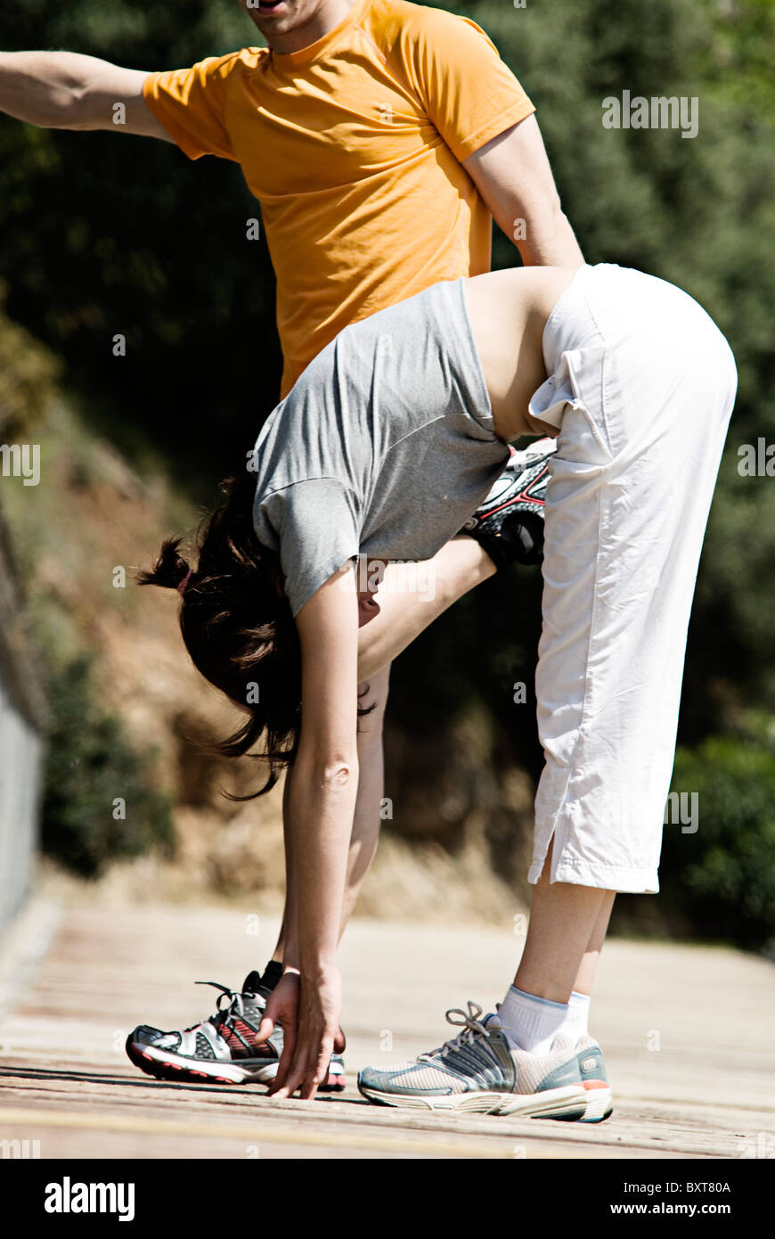 couple stretching after hard training Stock Photo - Alamy