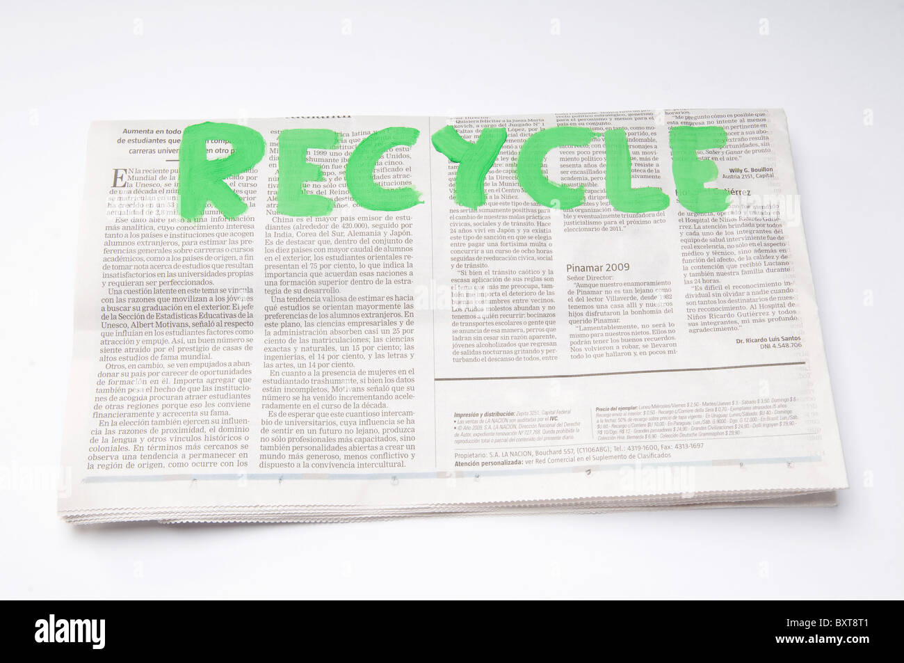 Recycle painted on newspaper Stock Photo - Alamy