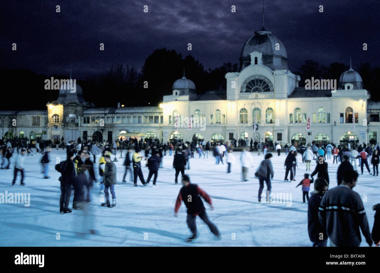 People Ice Skating At Night Stock Photo - Alamy