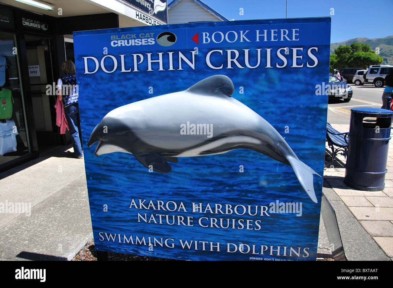 Dolphin Cruises sign outside office, Beach Road, Akaroa, Banks ...