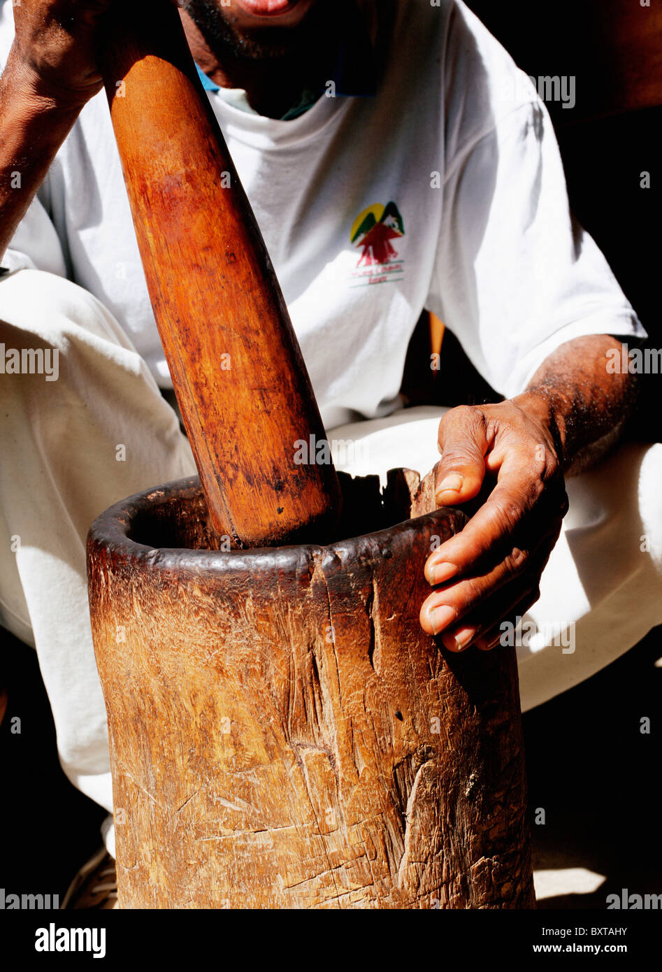 Man Crushing With Mortar And Pestle Stock Photo - Alamy