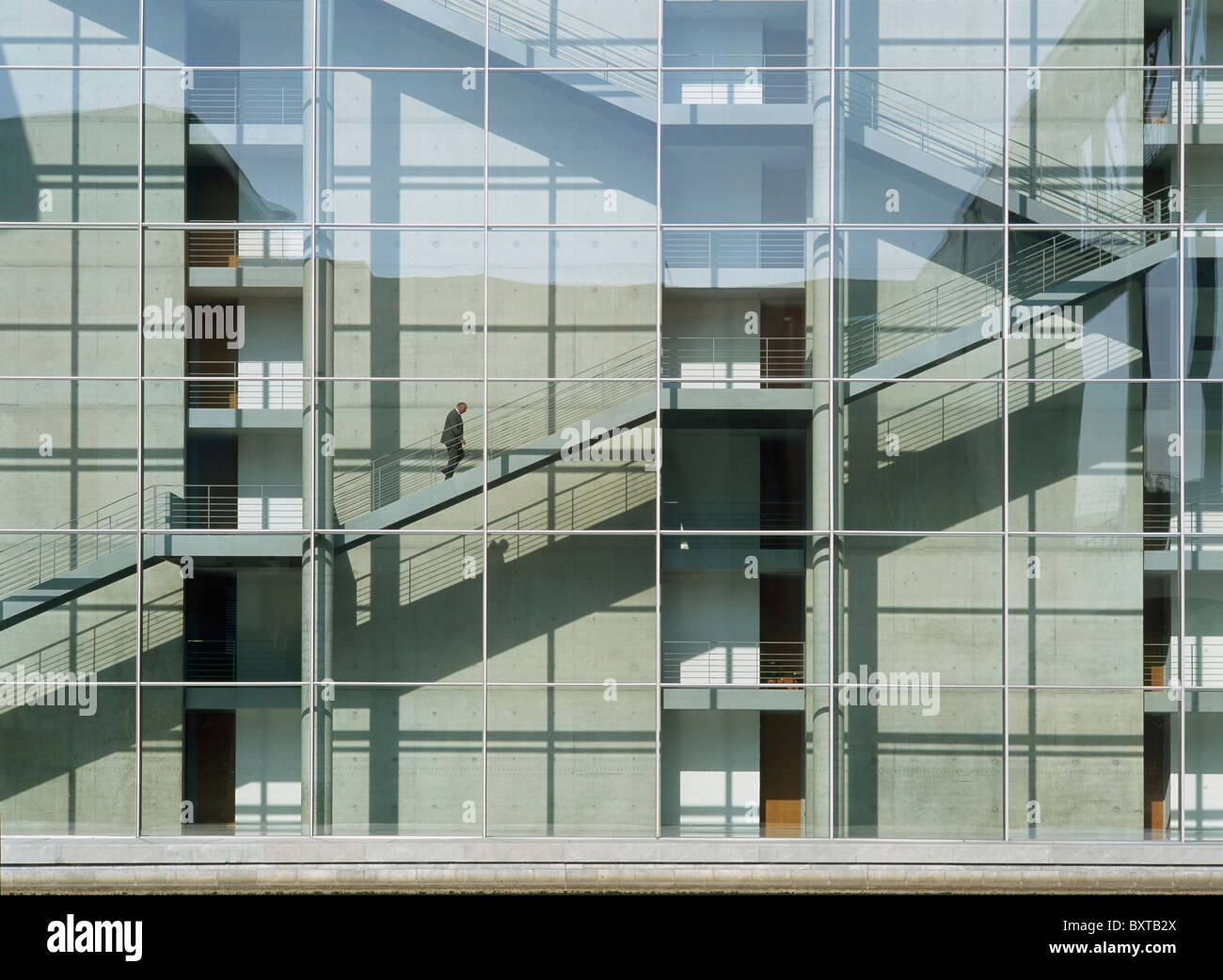 Man Walking Up Stairs In Modern Office Building Beside River Spree ...