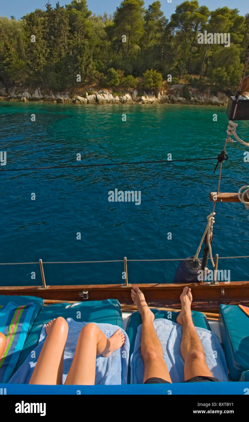 Couple Lying On Deck Of Yacht Sailing Near The Island Lefkas Stock ...