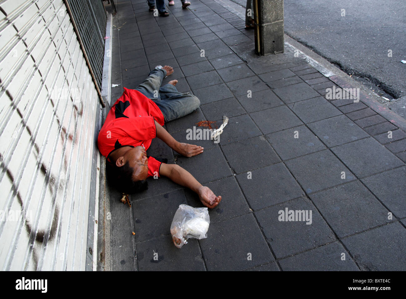A man sleeping on street Stock Photo - Alamy