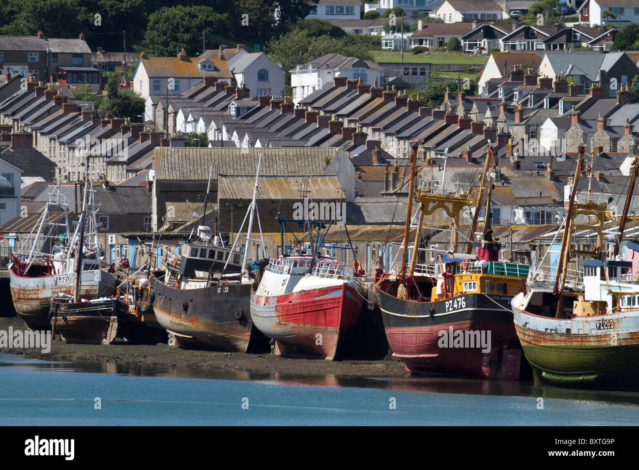 Ships at Newlyn harbour with buildings in background Stock Photo - Alamy
