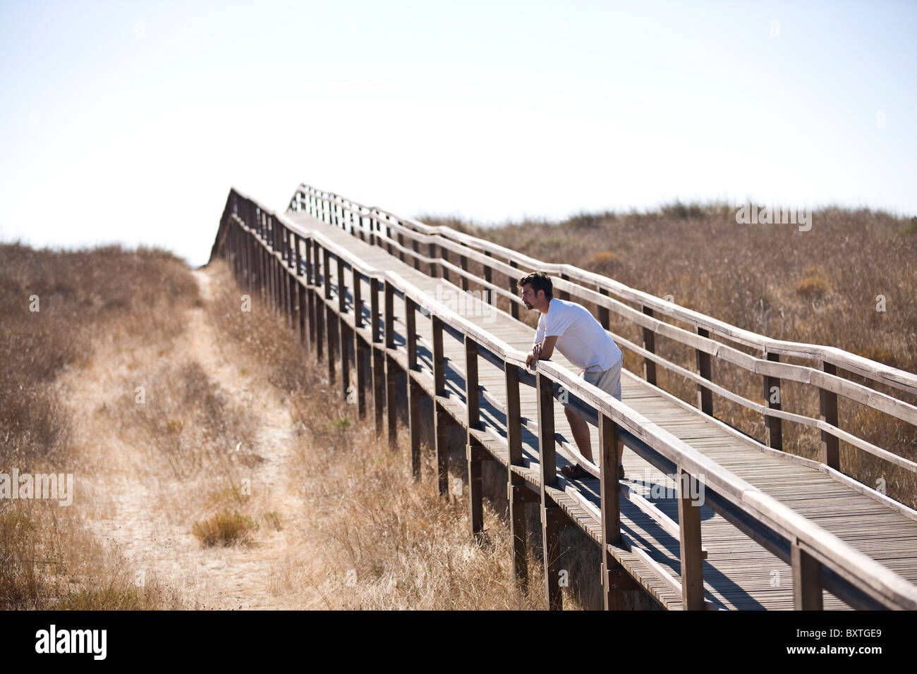 Leaning over the bridge High Resolution Stock Photography and Images ...