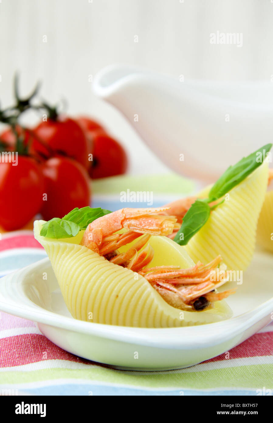 appetizer pasta shells with shrimp in a white plate Stock Photo - Alamy