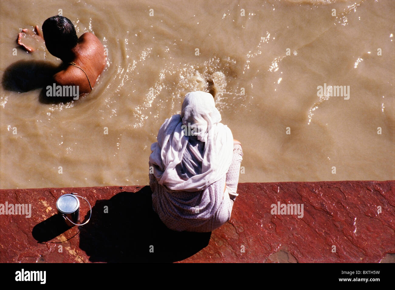 Indian woman bathing in river hi-res stock photography and images - Alamy