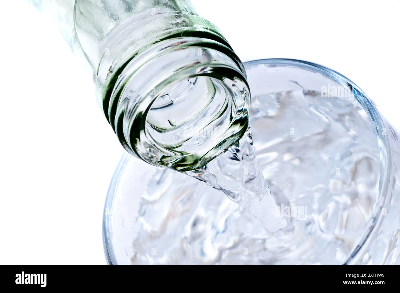 bottle pouring water into glass Stock Photo - Alamy