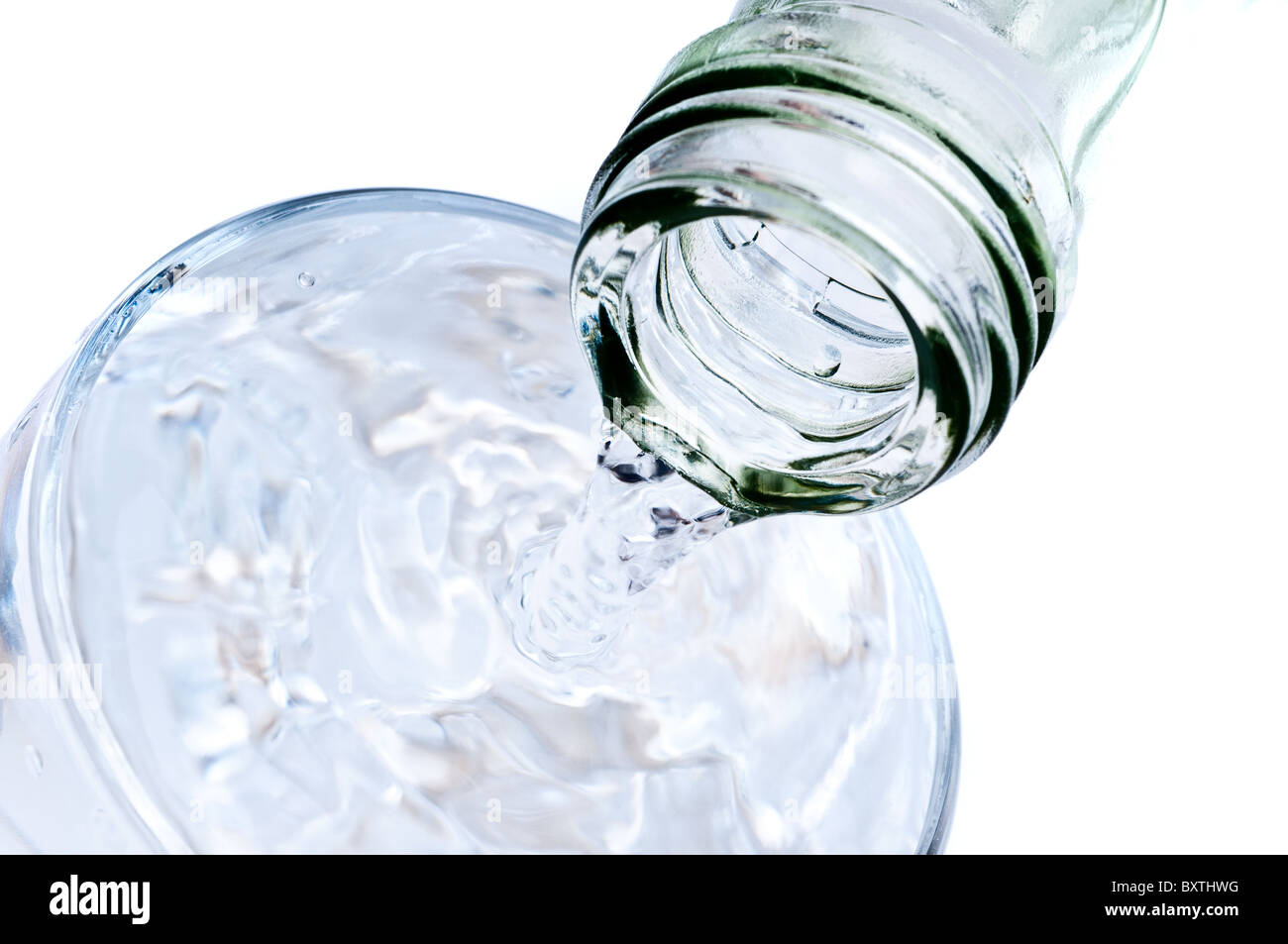 bottle pouring water into glass Stock Photo - Alamy