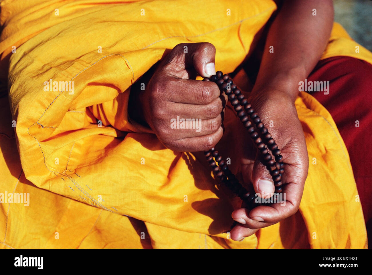 Monk Holding Prayer Beads Stock Photo - Alamy