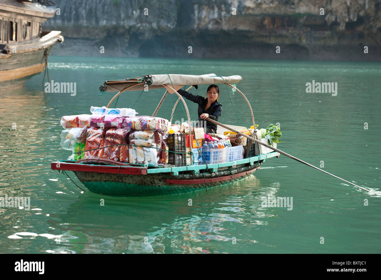 Floating shop at a floating village in Halong Bay, Vietnam Stock Photo ...