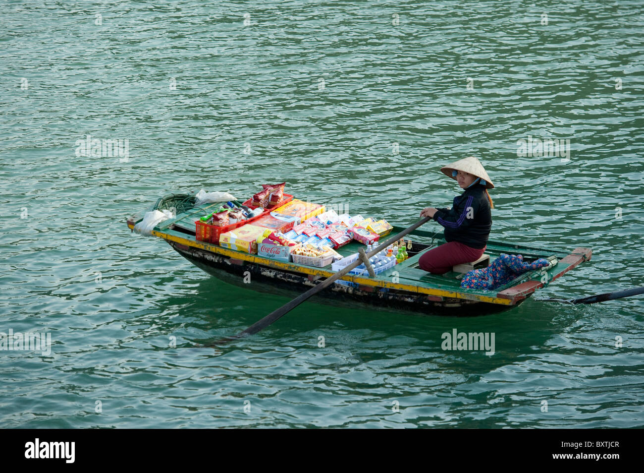 Floating shop at a floating village in Halong Bay, Vietnam Stock Photo ...