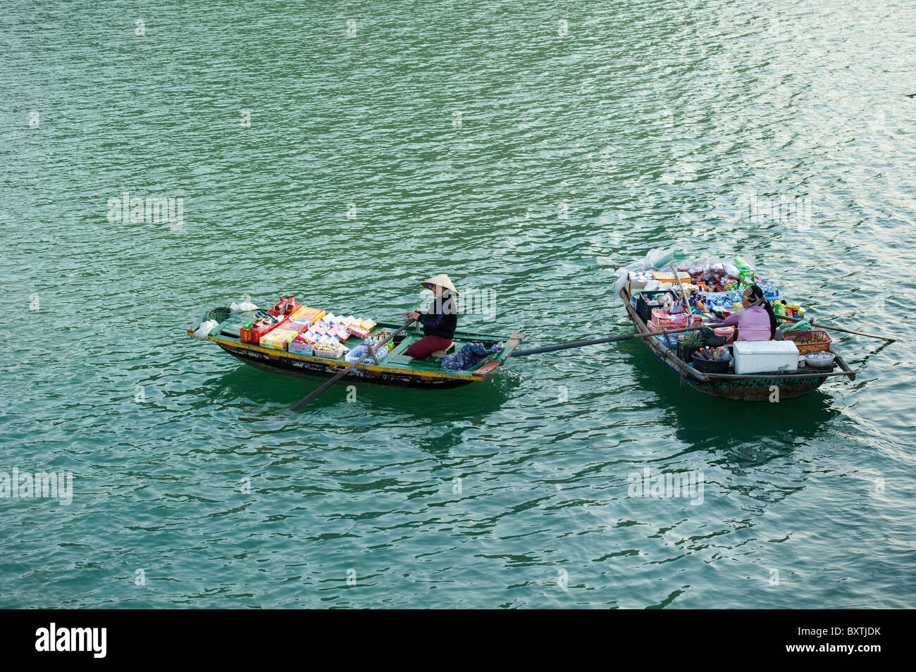 Floating shop at a floating village in Halong Bay, Vietnam Stock Photo ...