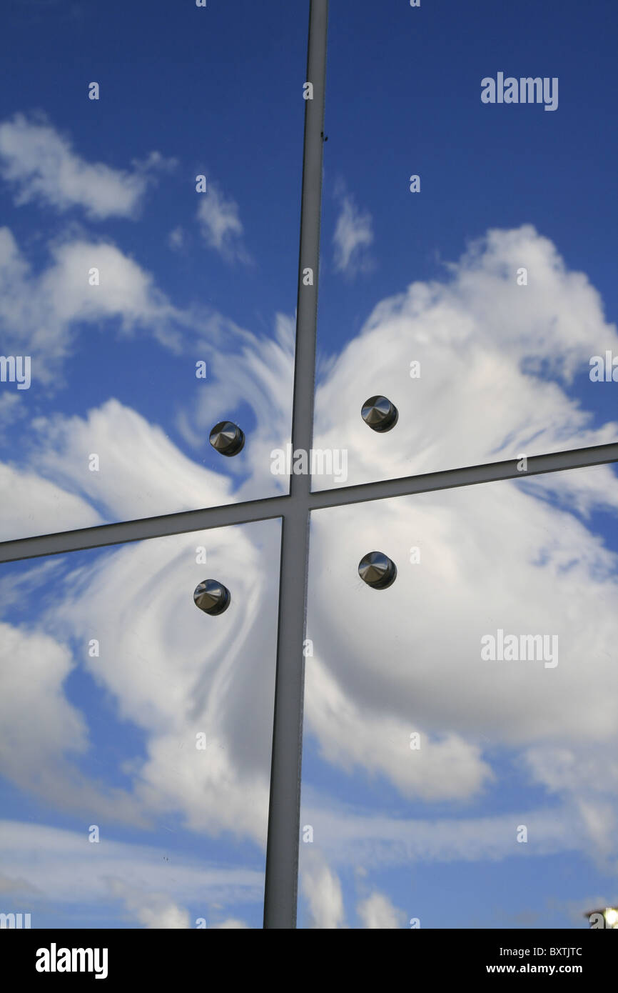 clouds reflection in a row of glass mirror panes Stock Photo - Alamy