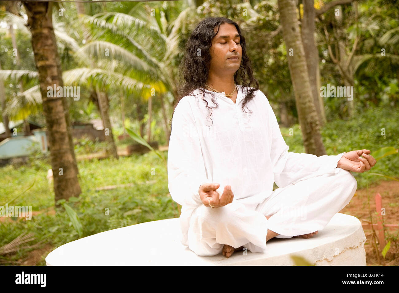 Indian Man Meditating Outside Stock Photo - Alamy