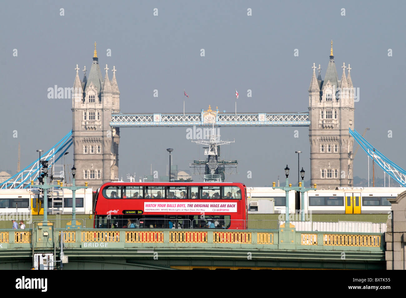 Train With Bus And Tower Bridge Stock Photo - Alamy