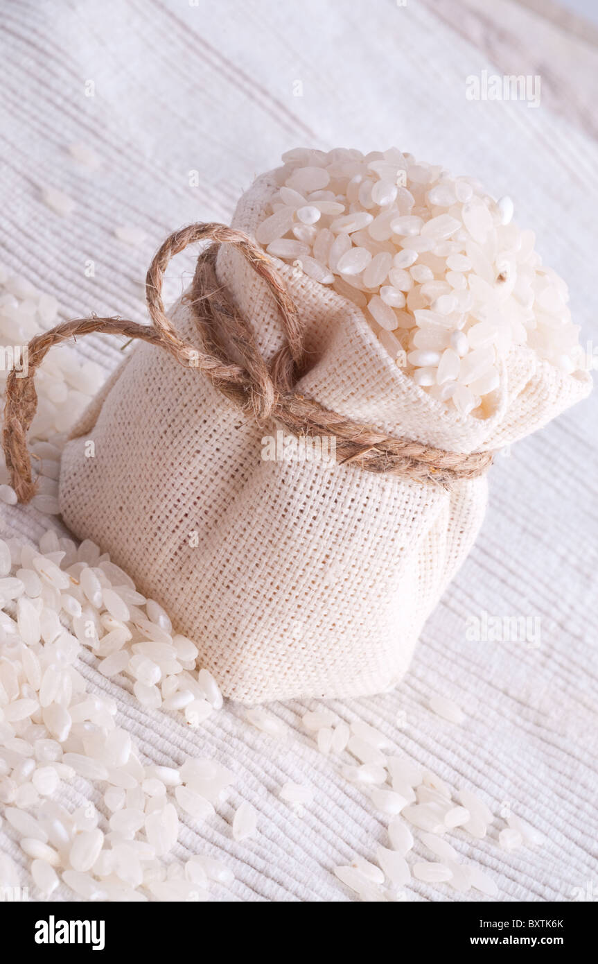 raw Rice in small sack Stock Photo - Alamy