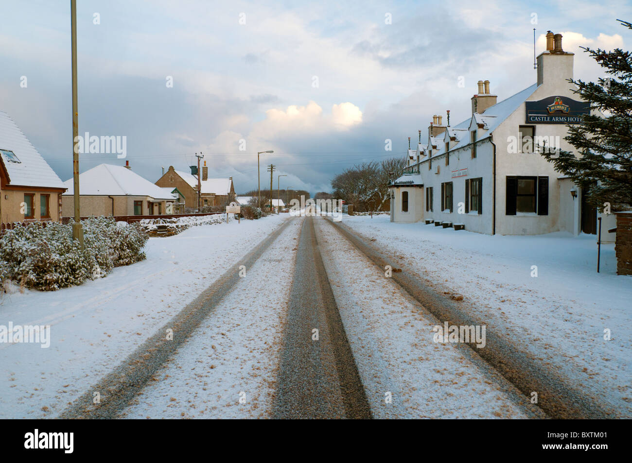 The main Thurso to John o'Groats road, the A836, snow covered in winter ...