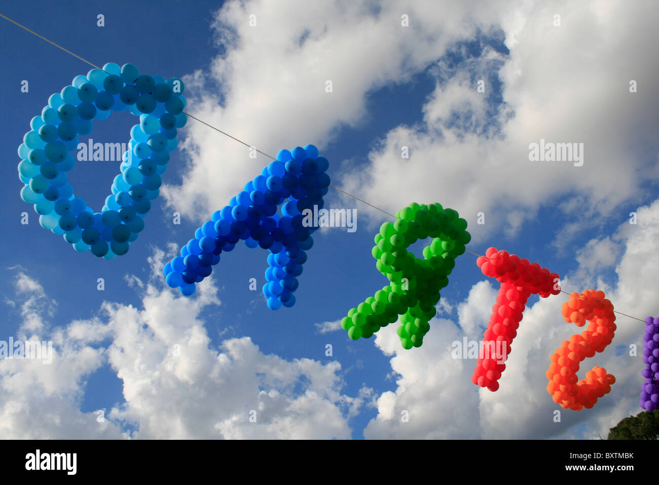 art word made out of balloons and blue sky Stock Photo - Alamy