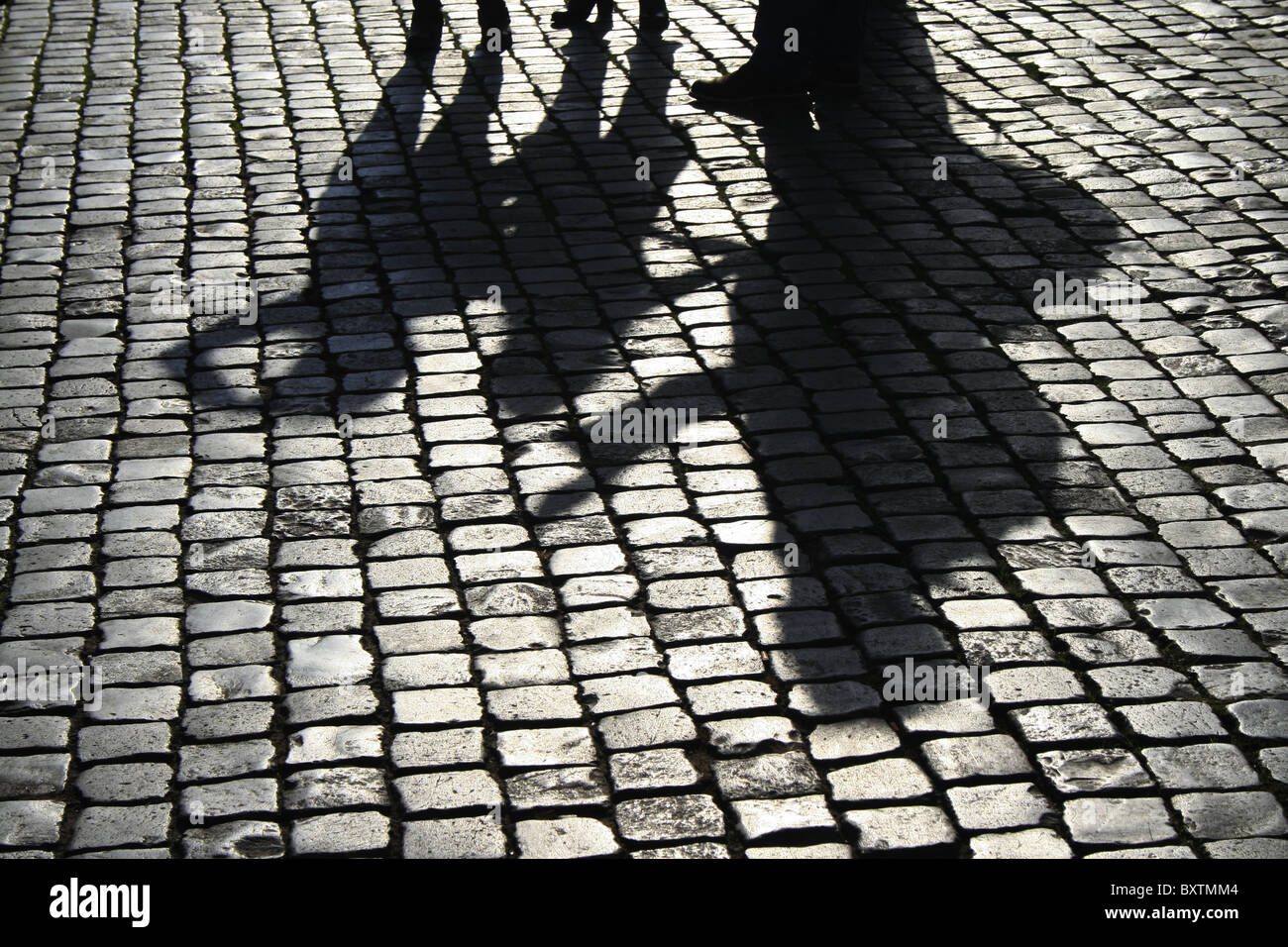 shadow of person on street road in city town Stock Photo - Alamy