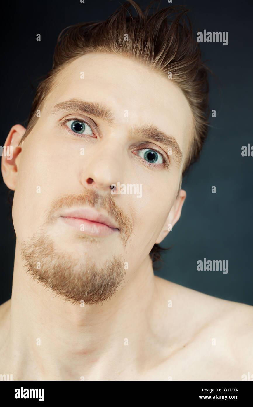 Beautiful smiling face of a young man close up Stock Photo - Alamy