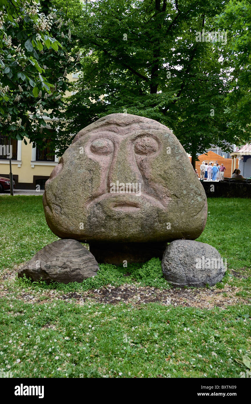 An arty representation of a glum face carved into a large boulder, Livu ...