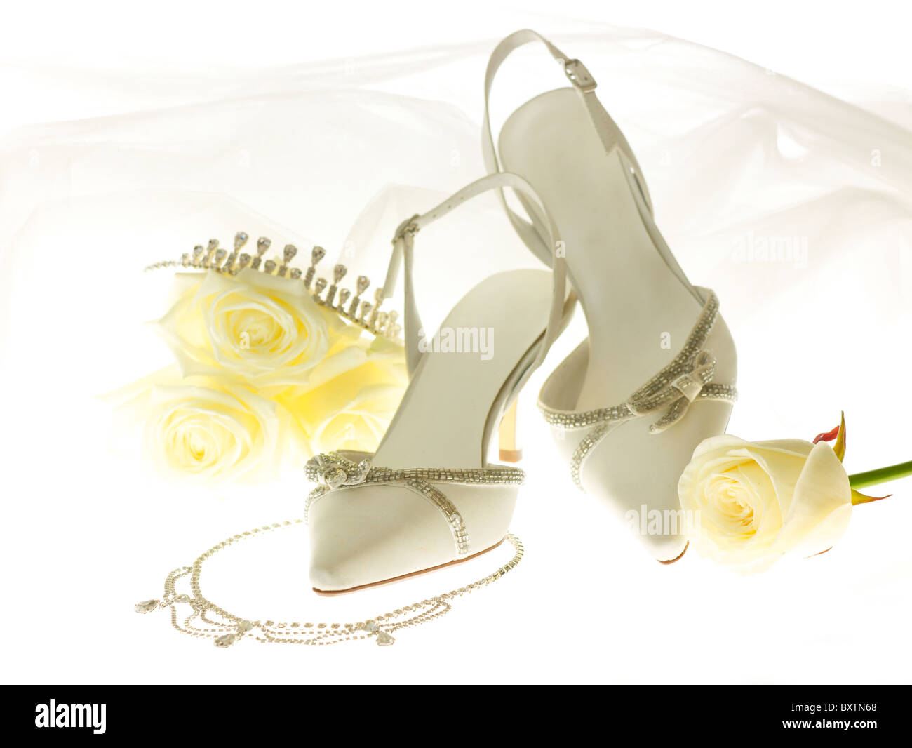womens white wedding shoes with tiara and necklace Stock Photo - Alamy