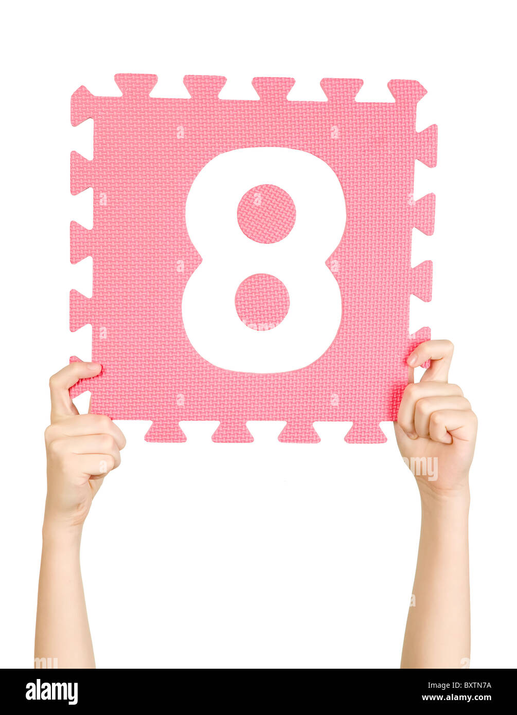 Child is holding number eight in his hand Stock Photo - Alamy