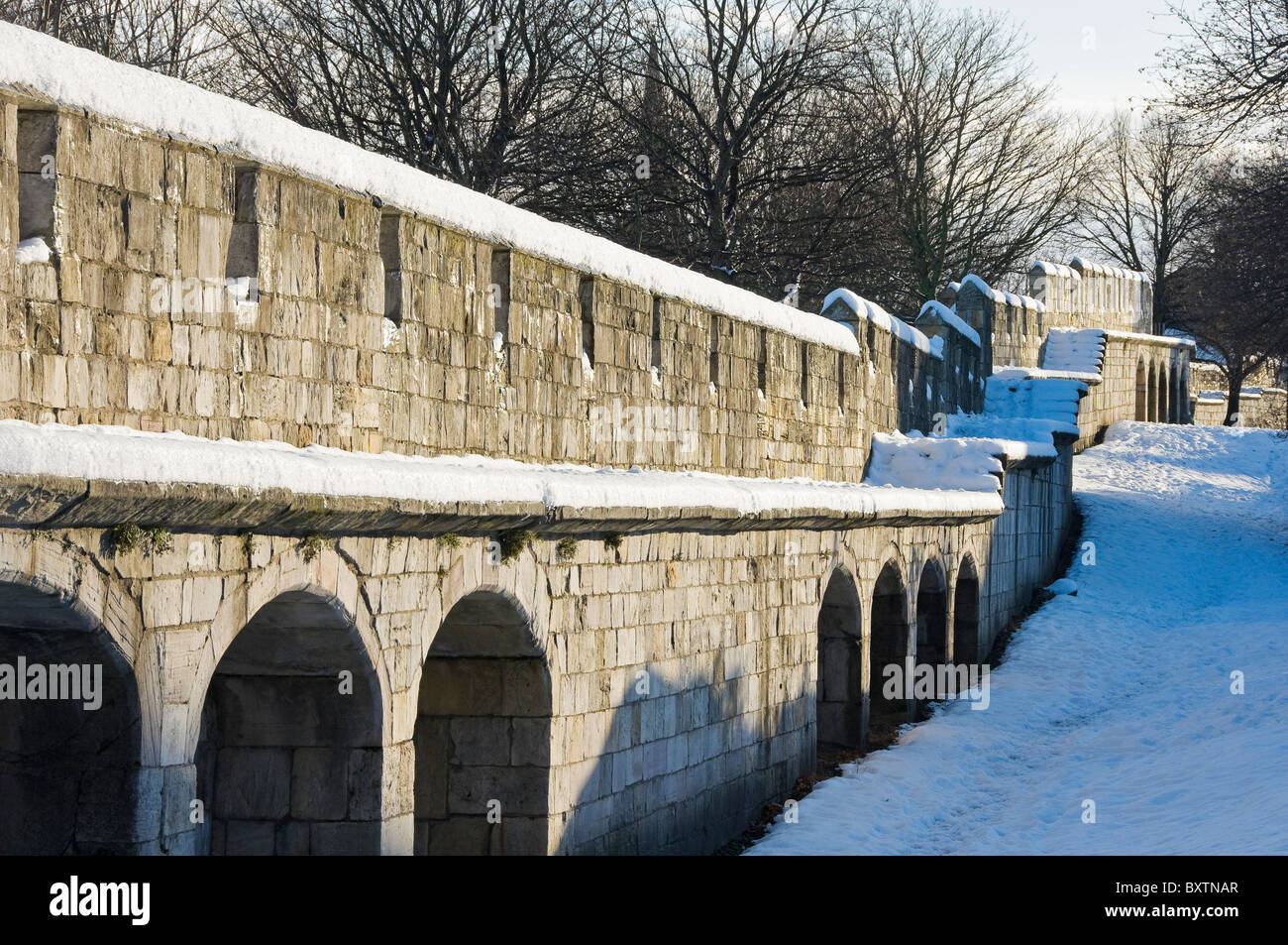 Snow covered Medieval City Walls in winter weather scene York North ...