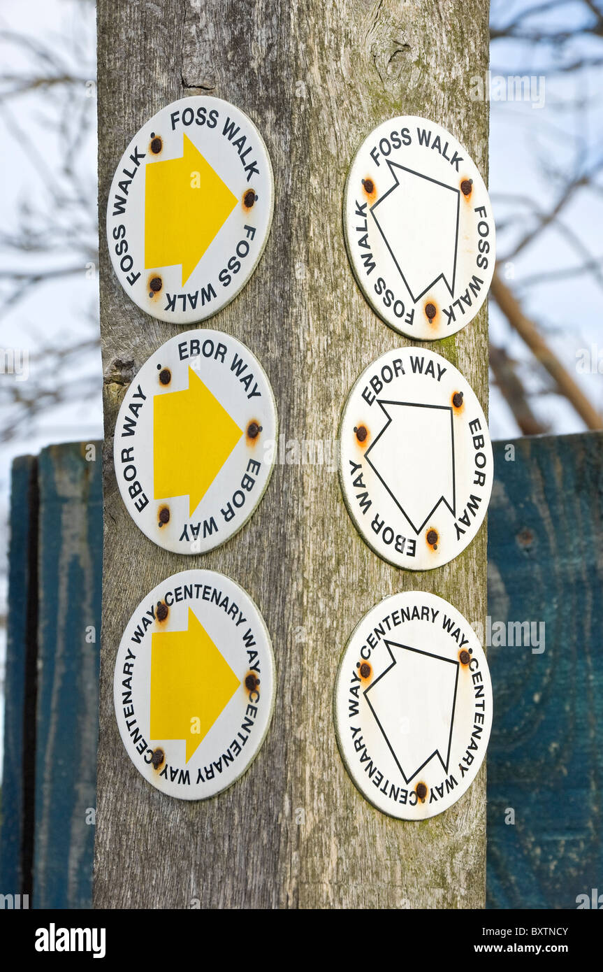 Signs on wooden post close up for Centenary Way Ebor Way and Foss Walk ...