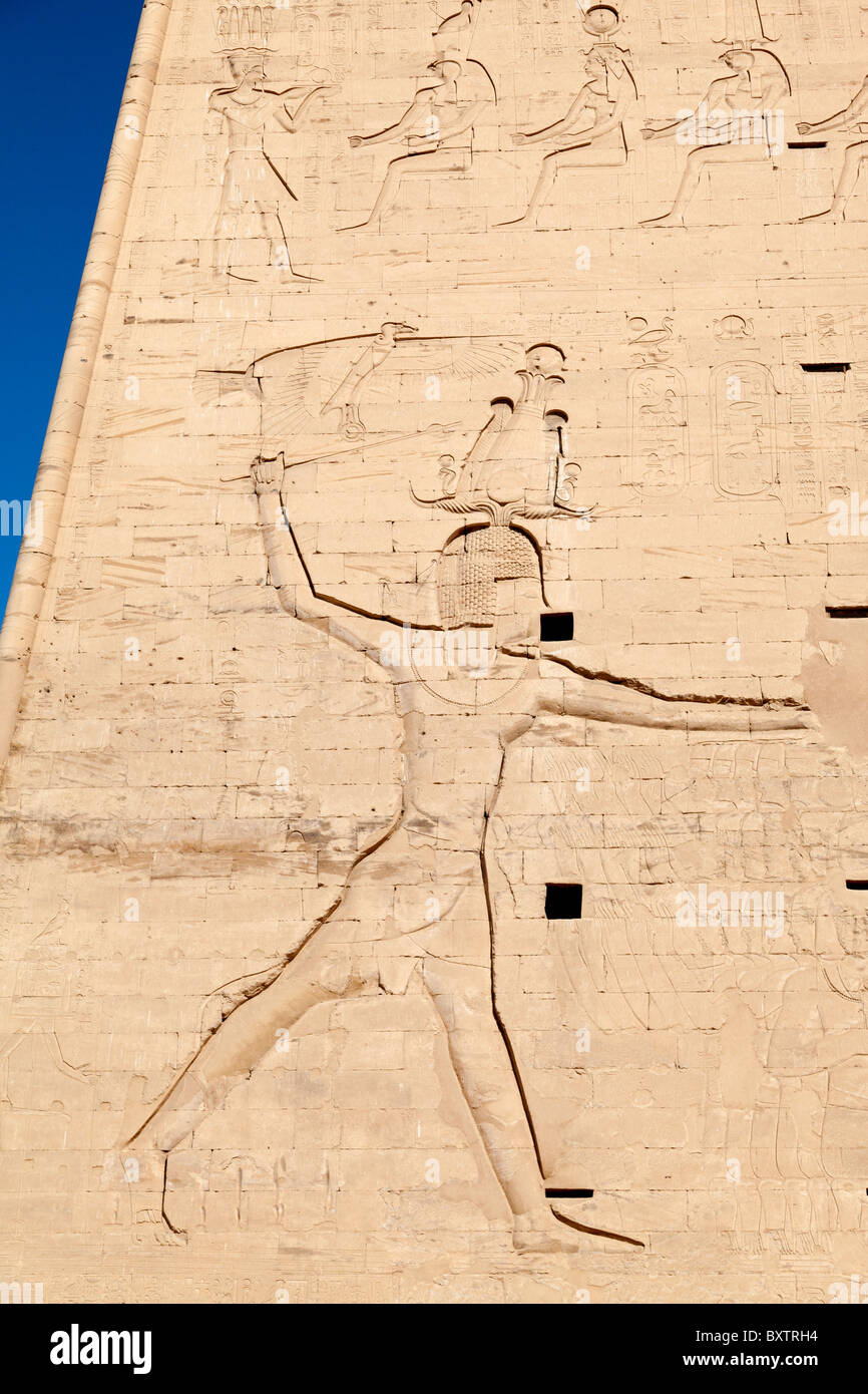 Edfu Temple, Egypt - giant carving on front facade Stock Photo - Alamy