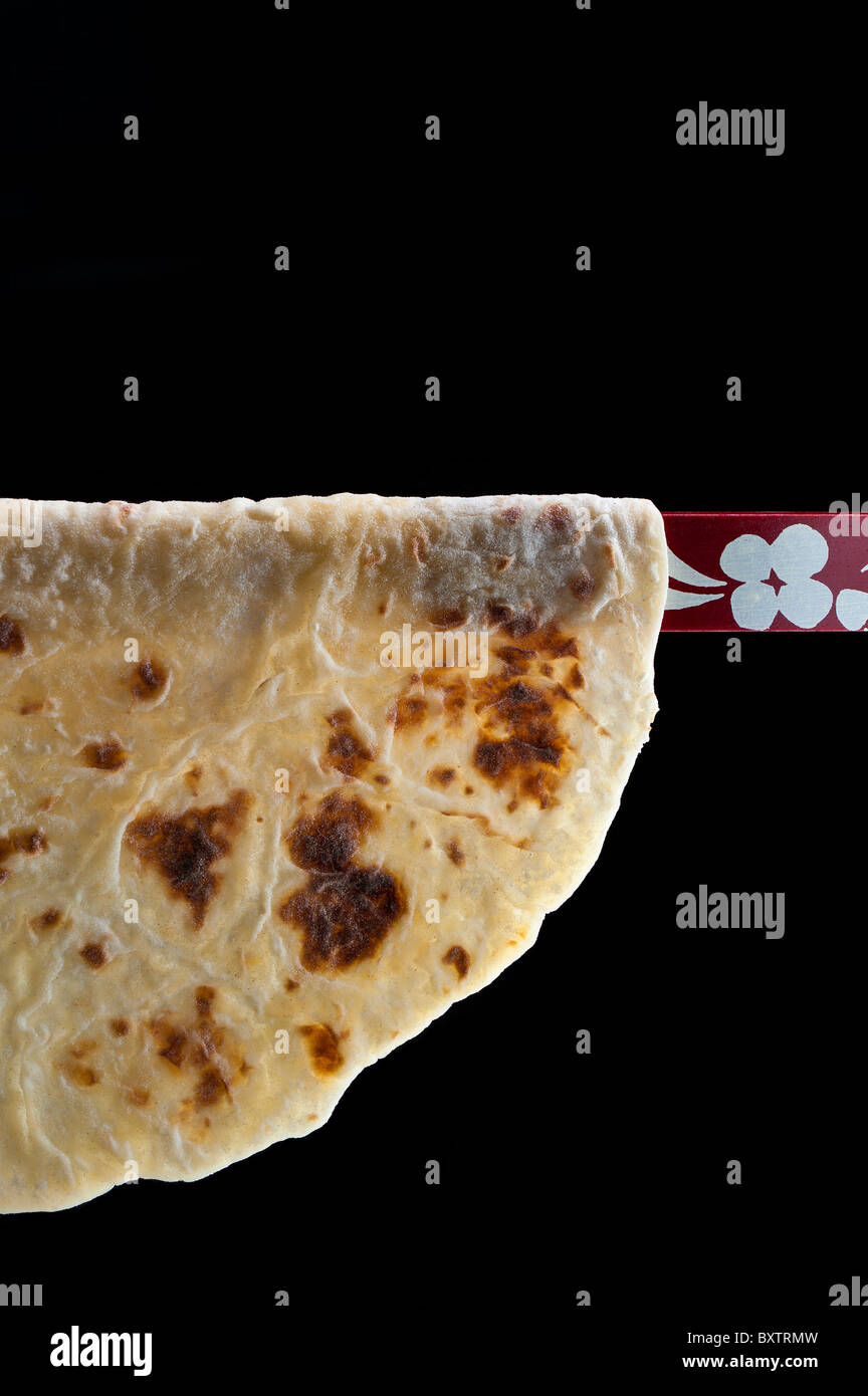 LEFSE HANGING FROM A TURNING STICK Stock Photo - Alamy