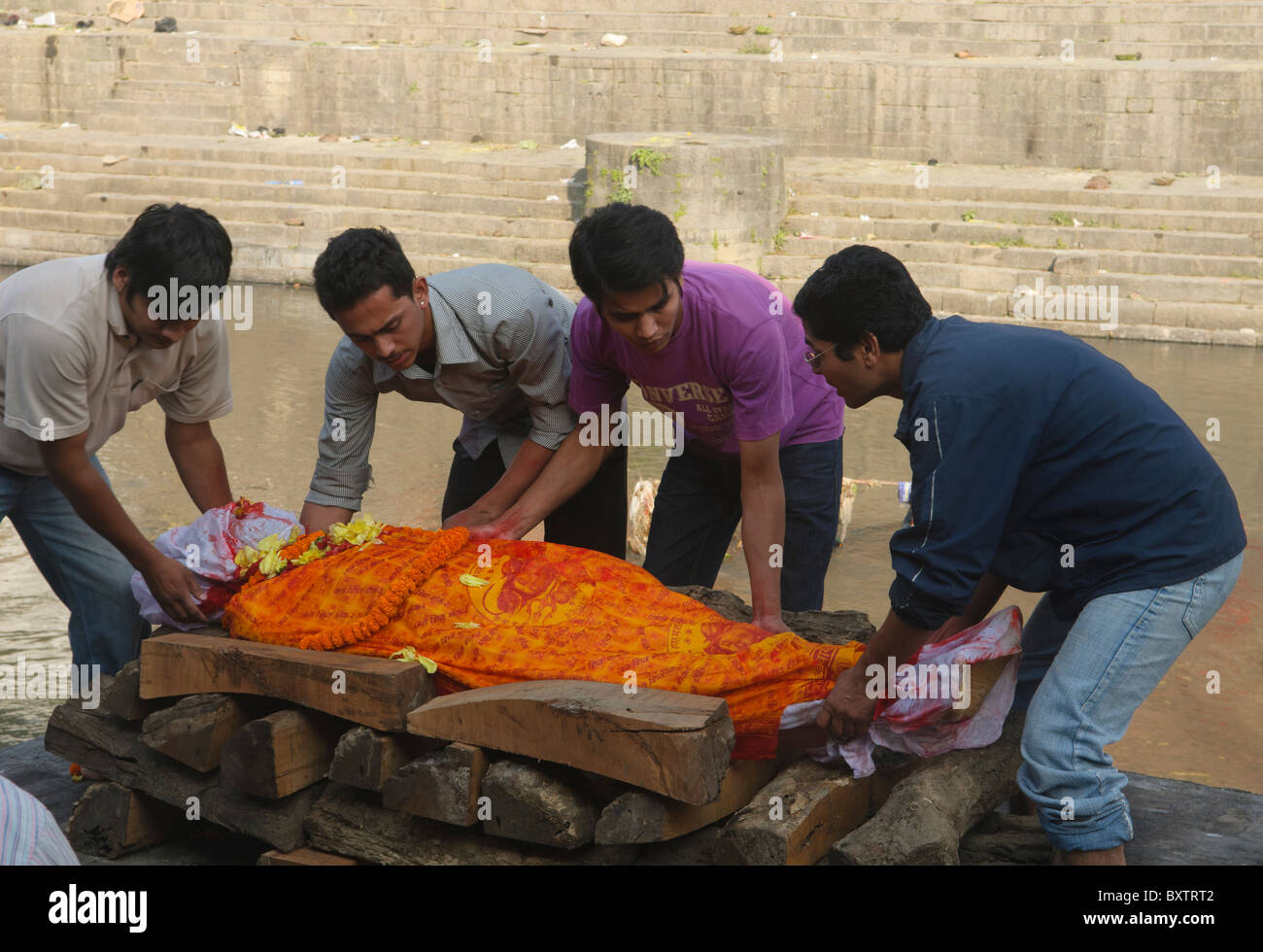 last rites at a cremation funeral on the Bagmati River at the ...
