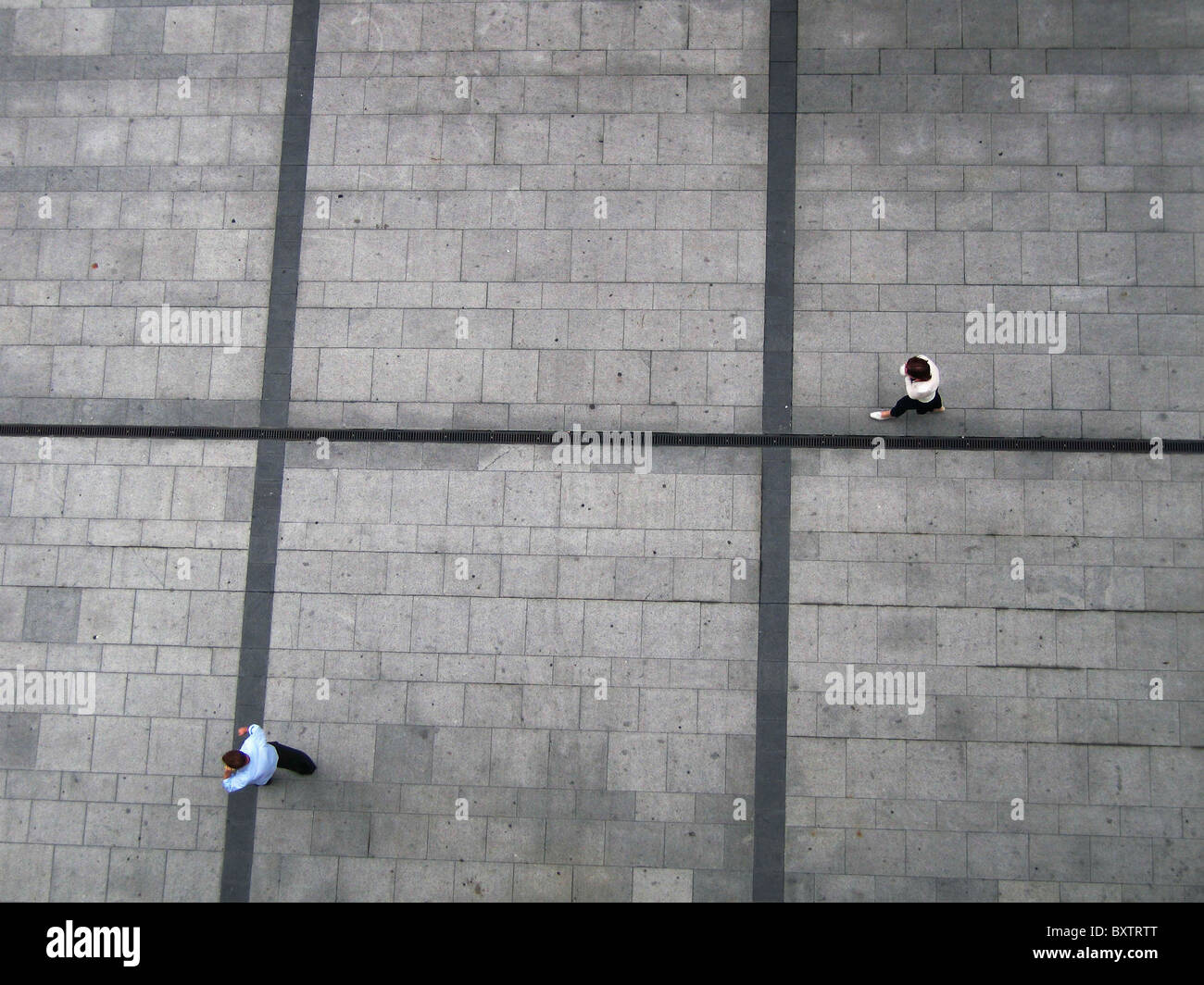 Two People Walking On Pavement, Aerial View Stock Photo - Alamy