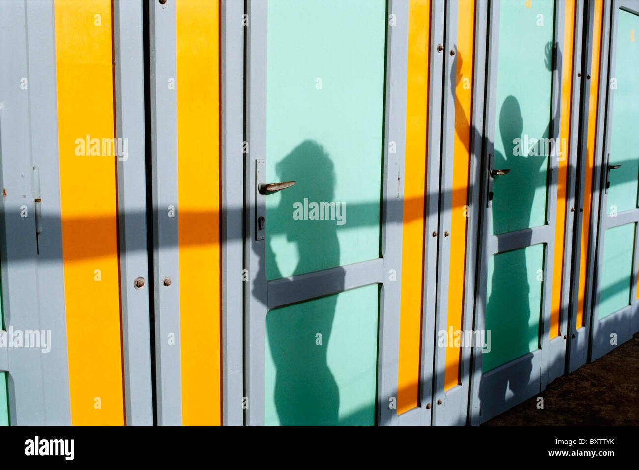 Tourists' Shadows In Beach Huts Stock Photo - Alamy