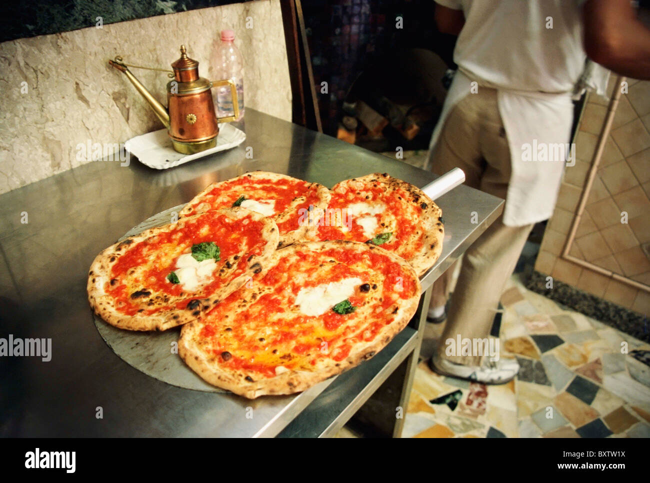 Cooking Pizzas, Freshly Baked Pizza At Naples Stock Photo - Alamy