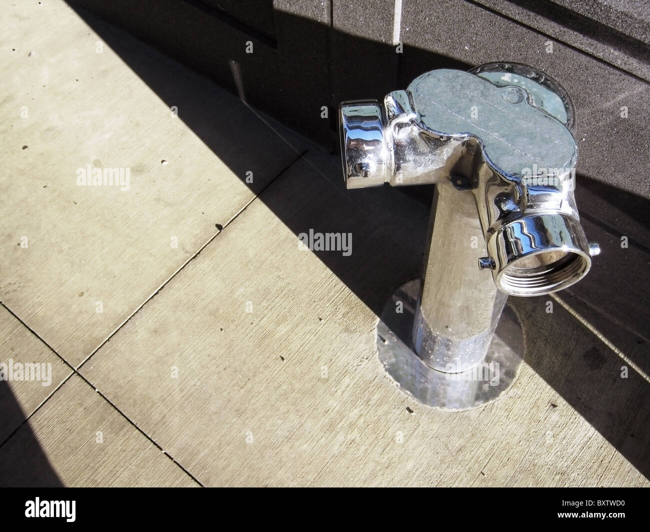 Shiny new silver fire hydrant on a city sidewalk Stock Photo - Alamy