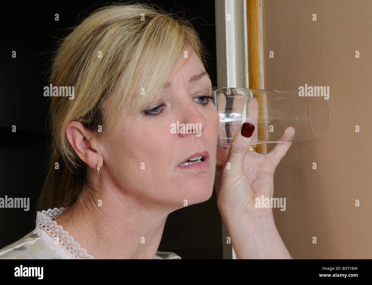 Glass to wall eavesdrop hi-res stock photography and images - Alamy