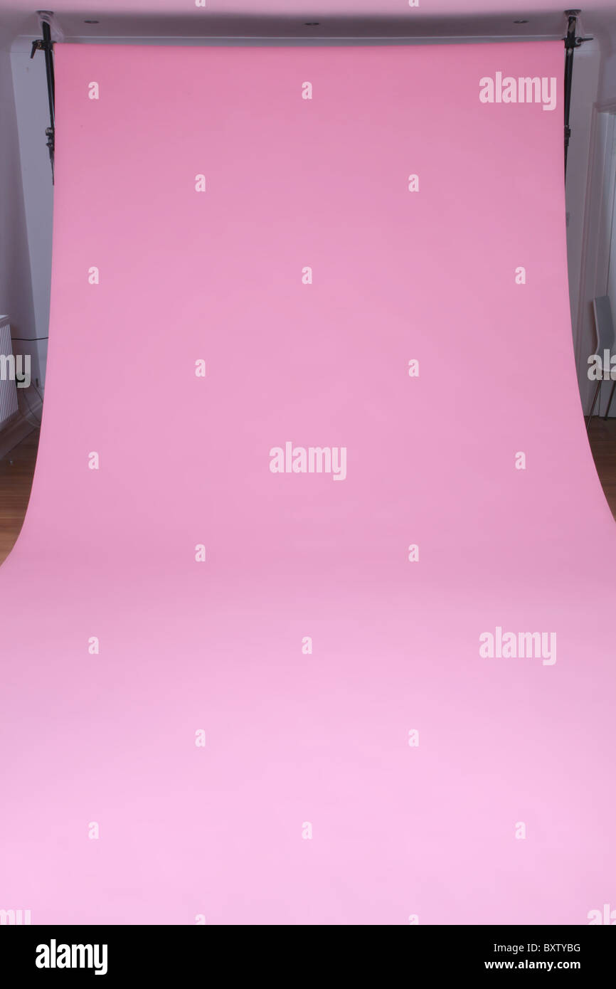 Pink photographic studio backdrop Stock Photo - Alamy